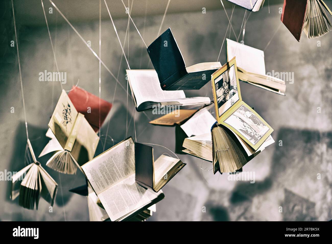 Books hanging in the air as an art object Stock Photo - Alamy