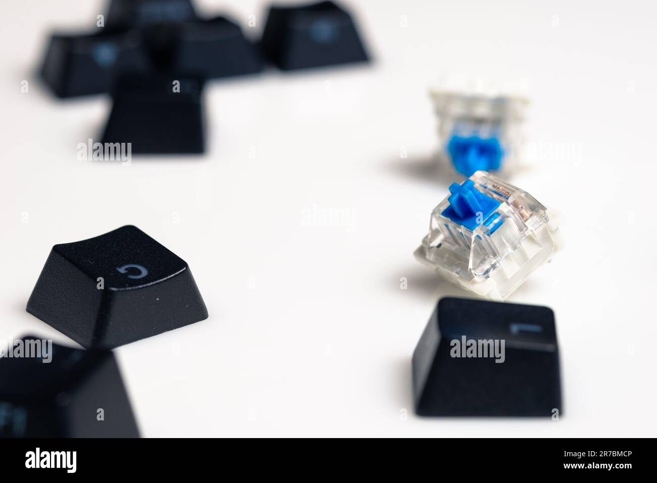 Scattered Key caps and Key switches for Mechanical Keyboards On White ...