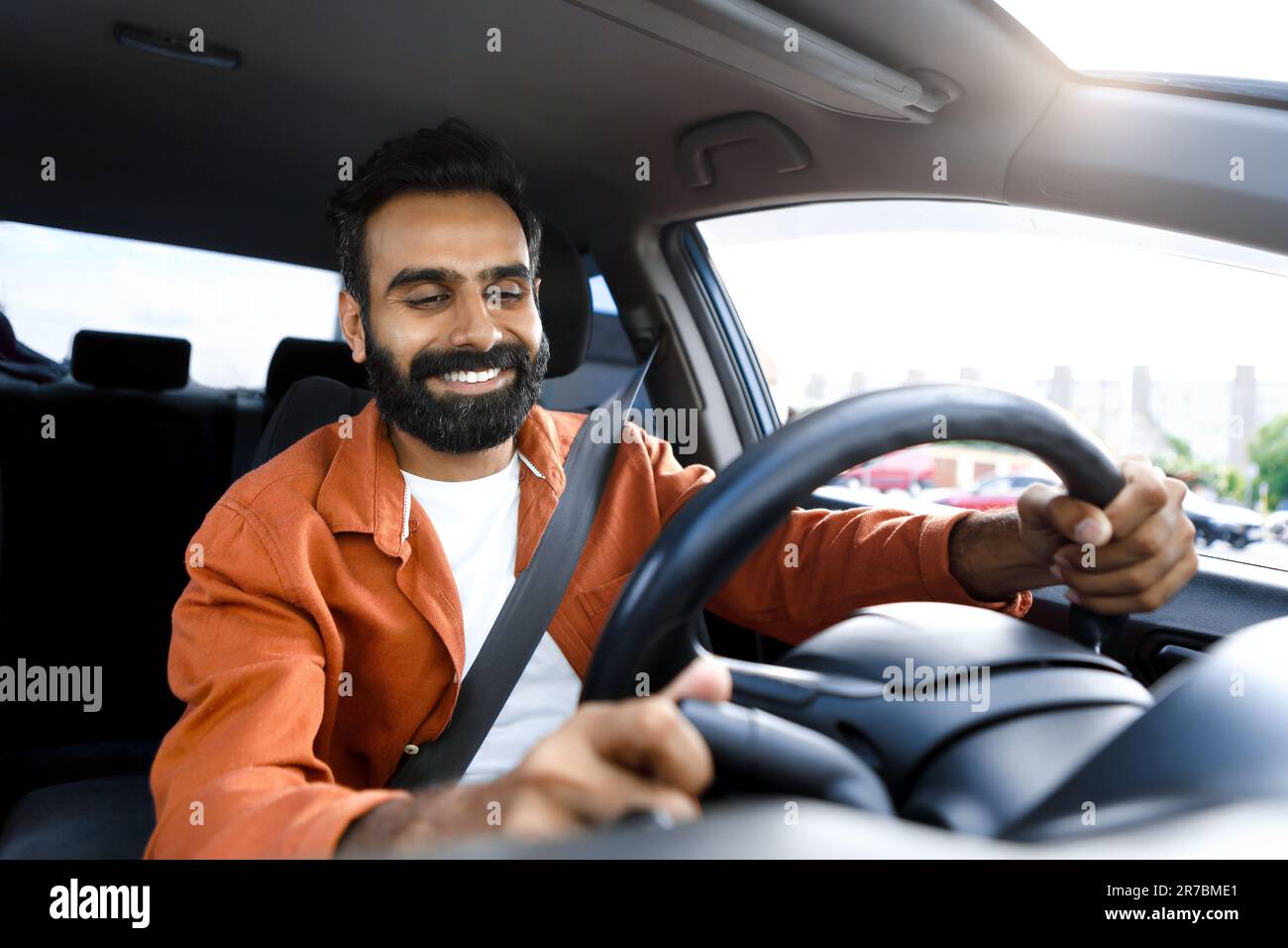 Confident indian man driving his new auto sitting in automobile Stock ...