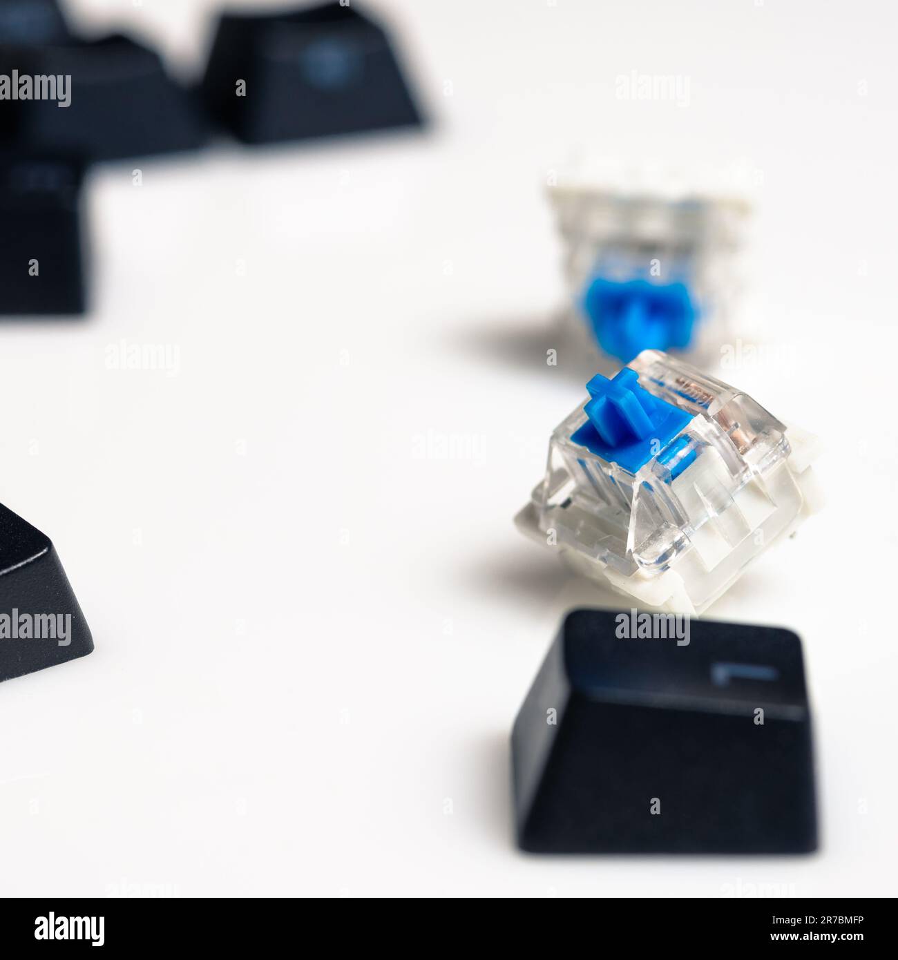 Scattered Key caps and Key switches for Mechanical Keyboards On White ...