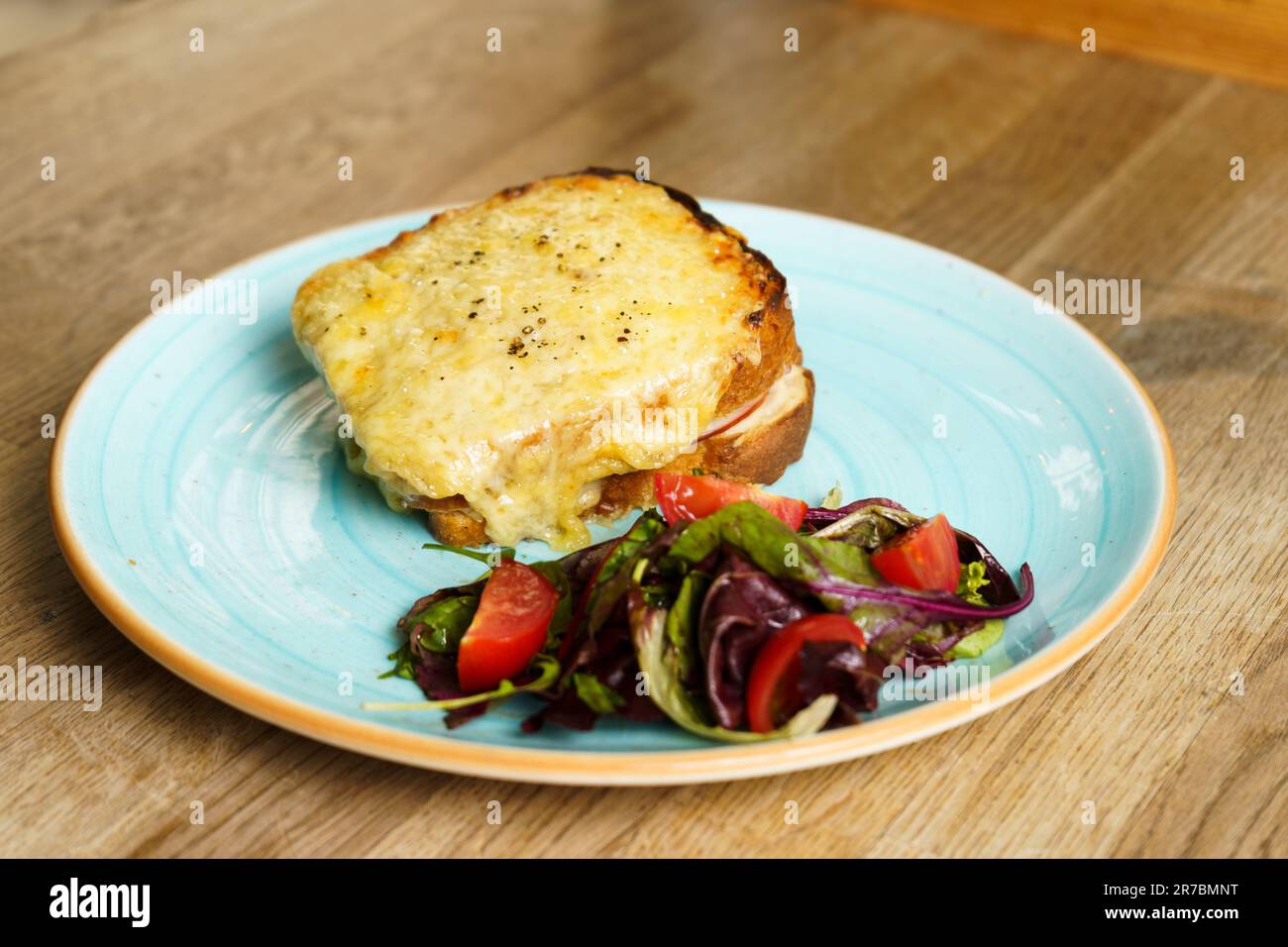 Classic french toast with cheese and ham, vegetables and honey-balsam ...