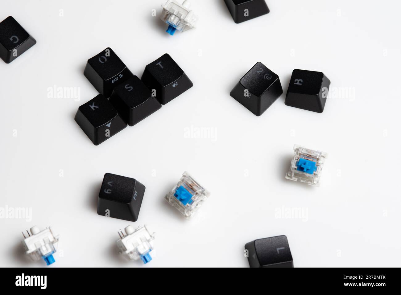 Scattered Key caps and Key switches for Mechanical Keyboards On White ...