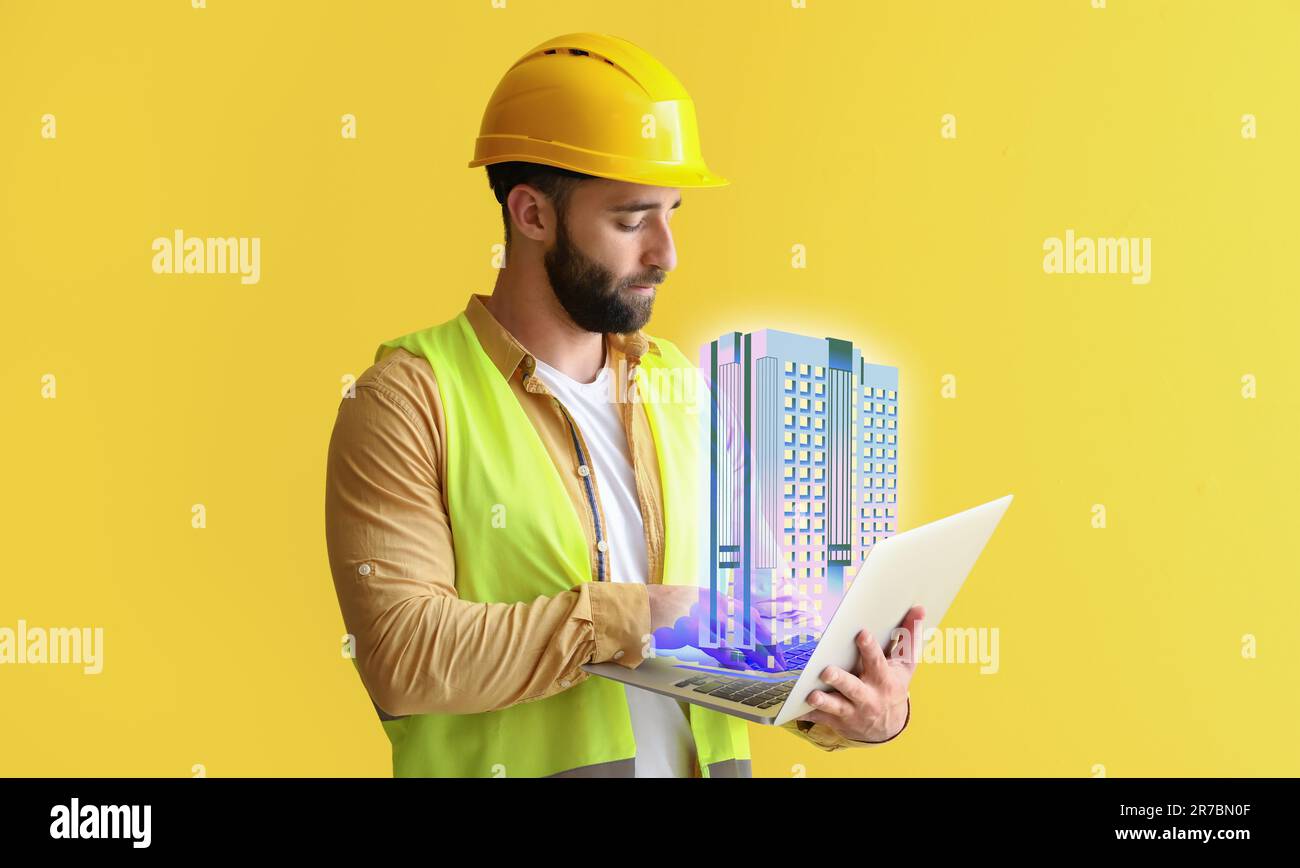 Male construction worker with laptop and new digital project of modern ...