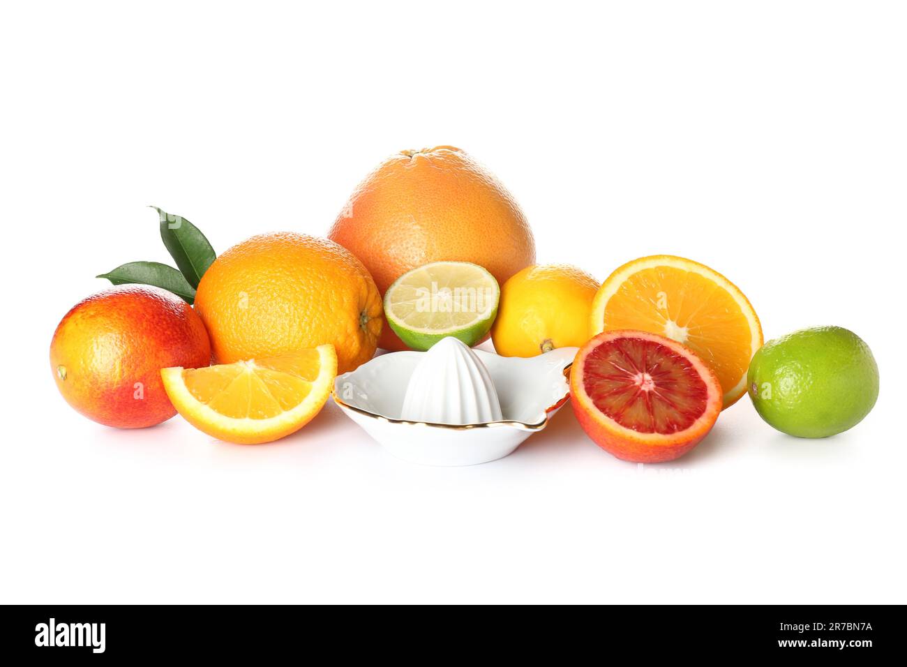 Ceramic juicer and citrus fruits on white background Stock Photo - Alamy