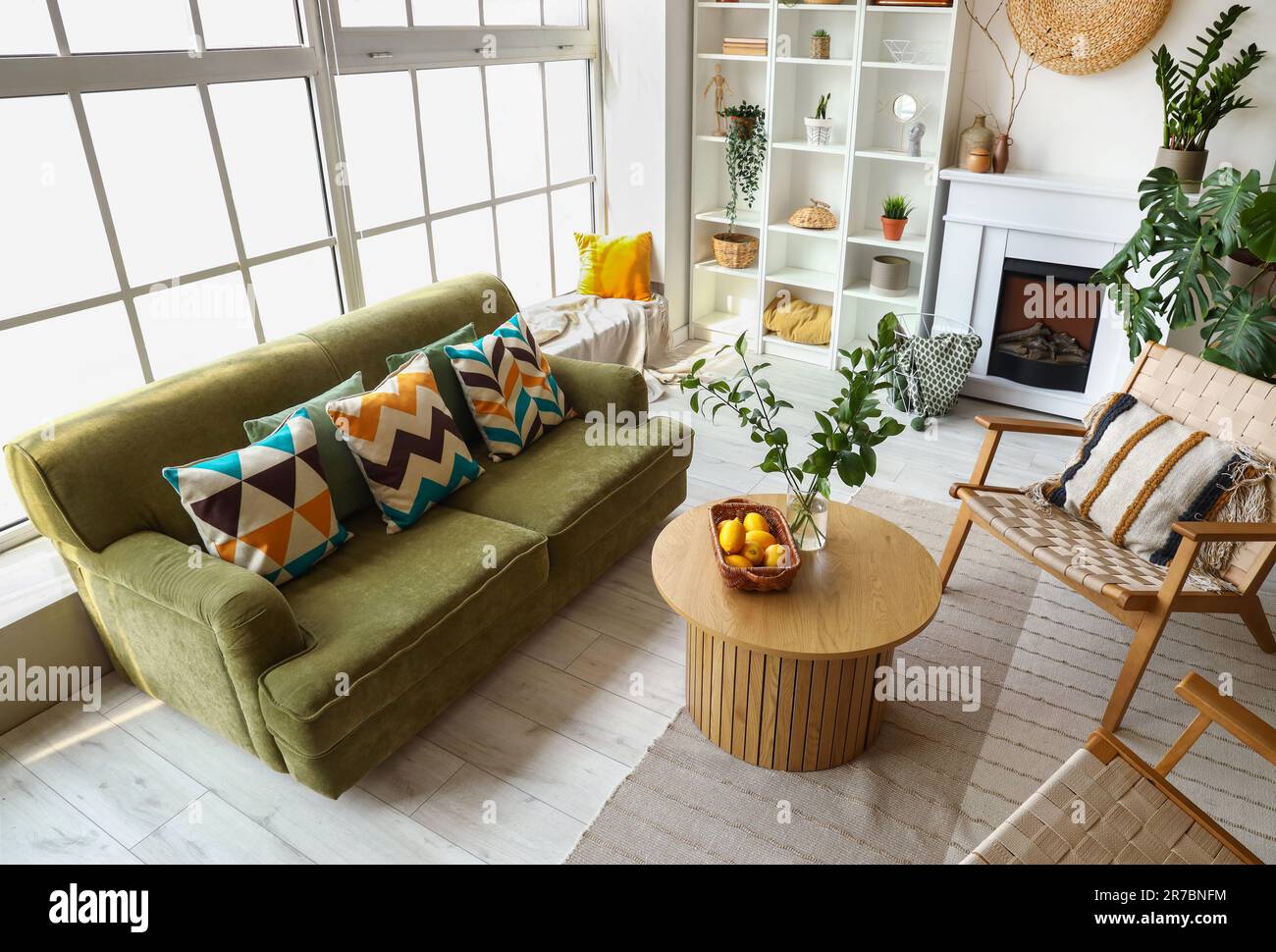 Interior of bright living room with cozy sofa, armchairs and coffee ...