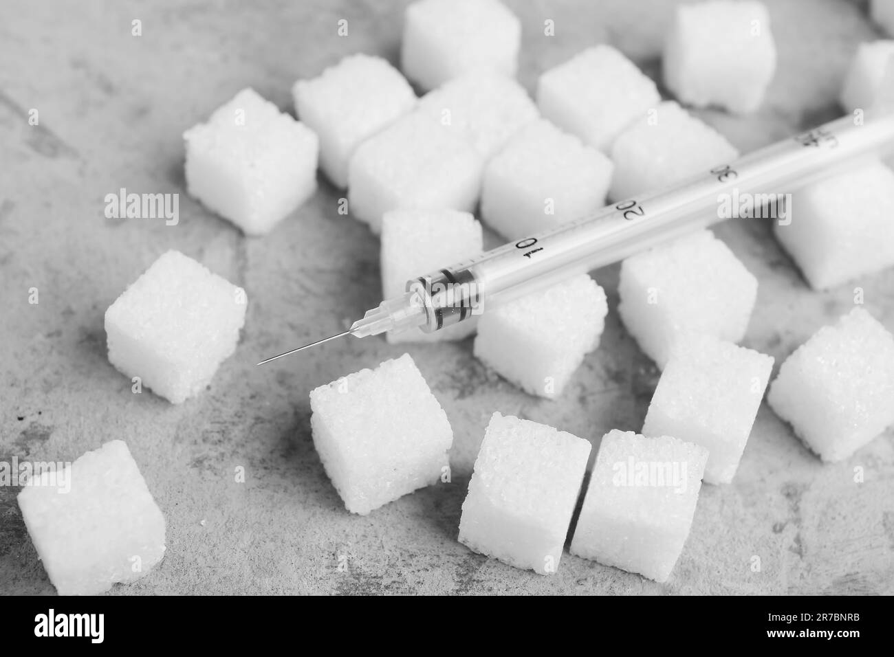 Sugar cubes with syringe for insulin injection on grunge background ...