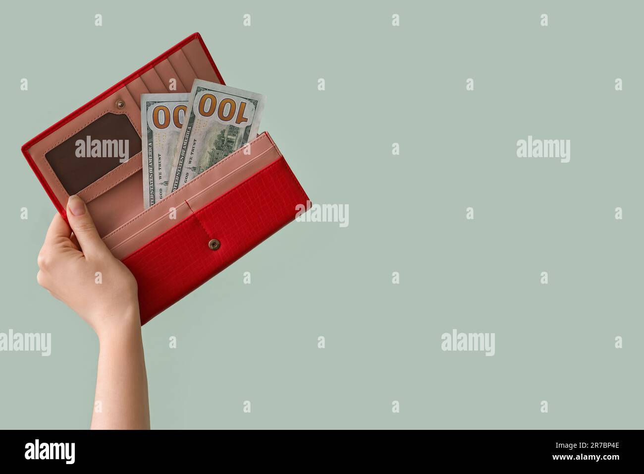 Woman with wallet and dollar banknotes on green background Stock Photo ...