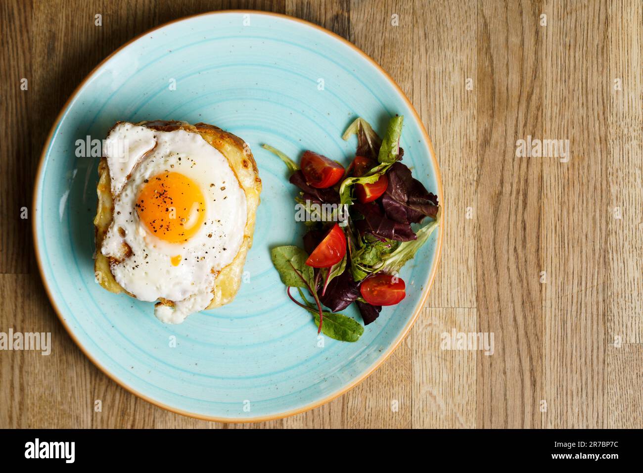Top Down view of Classic french toast with cheese and ham, fried eggs ...