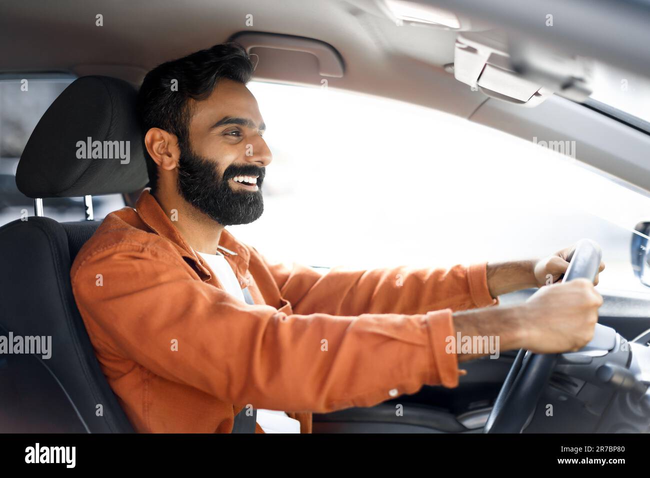 Proud Indian Driver Guy Driving Luxury Automobile, Posing In Vehicle ...