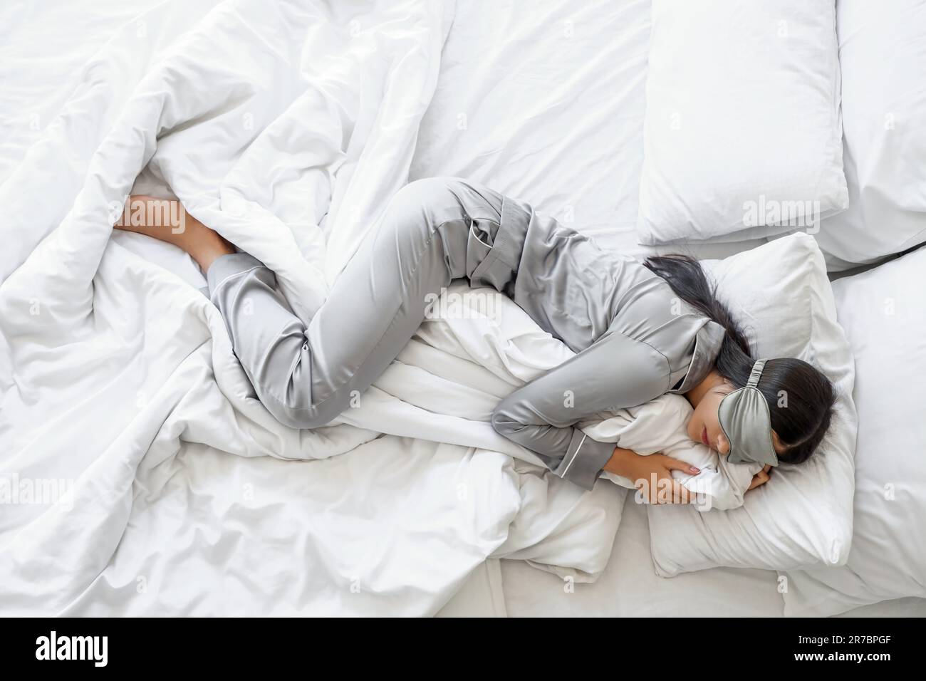 Young woman sleeping in bedroom, top view Stock Photo - Alamy