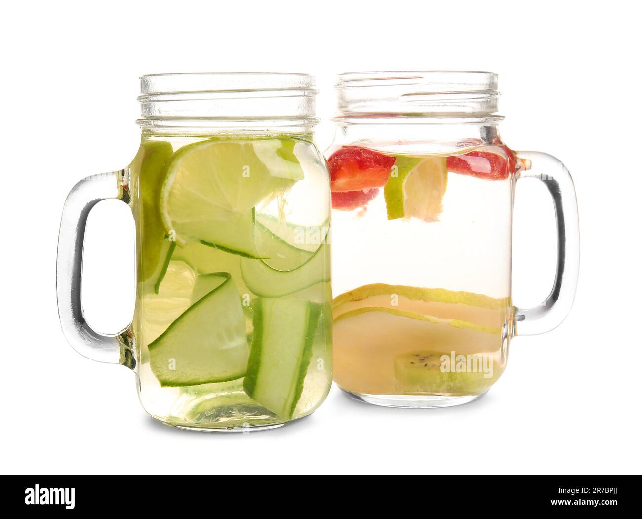 Mason jars of infused water with different sliced fruits on white ...