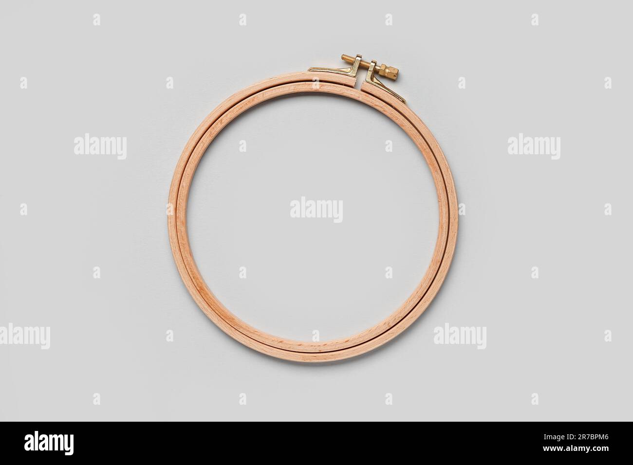 Wooden embroidery hoop on grey background Stock Photo - Alamy
