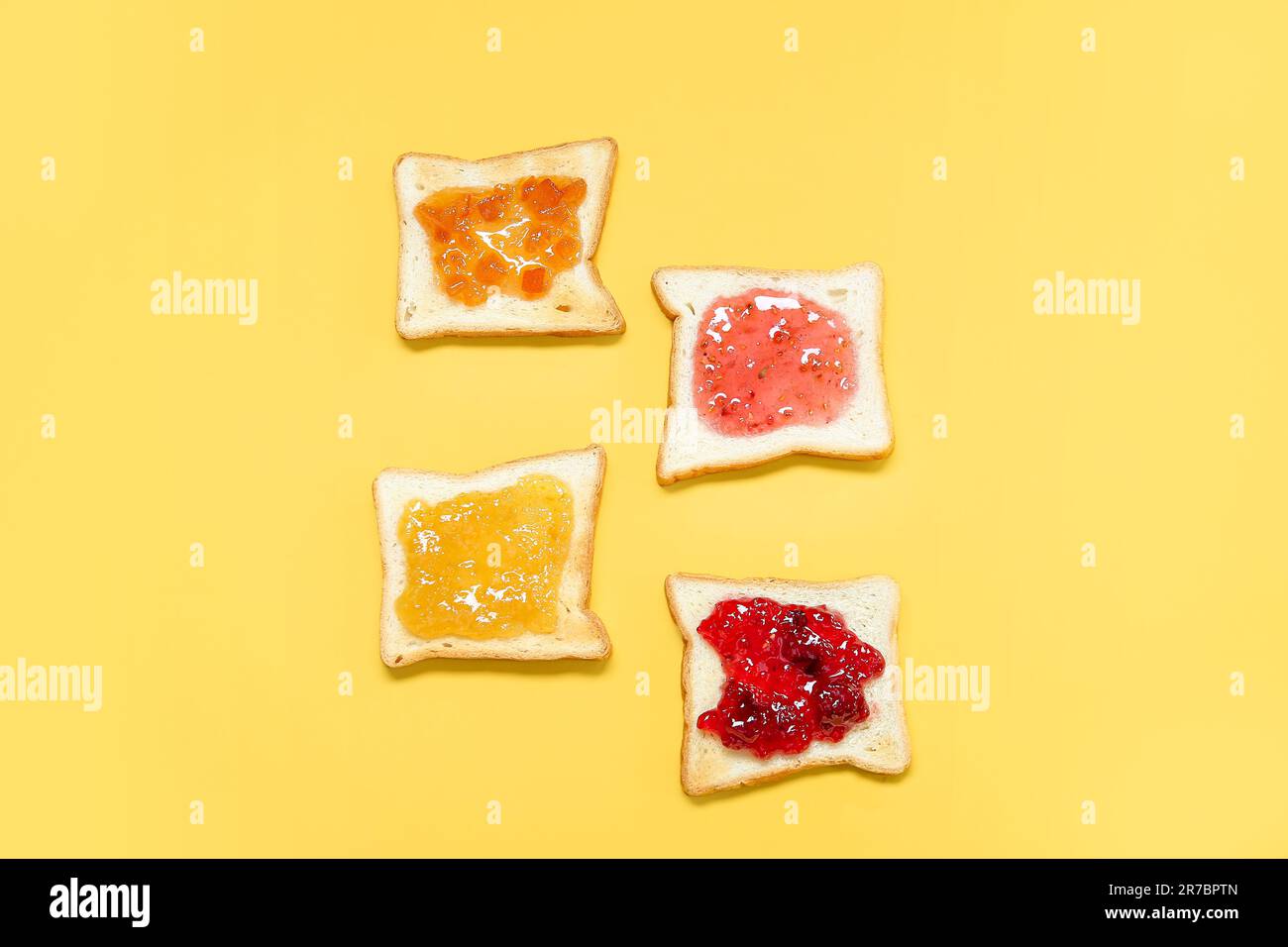 Delicious toasts with different jams on color background Stock Photo ...