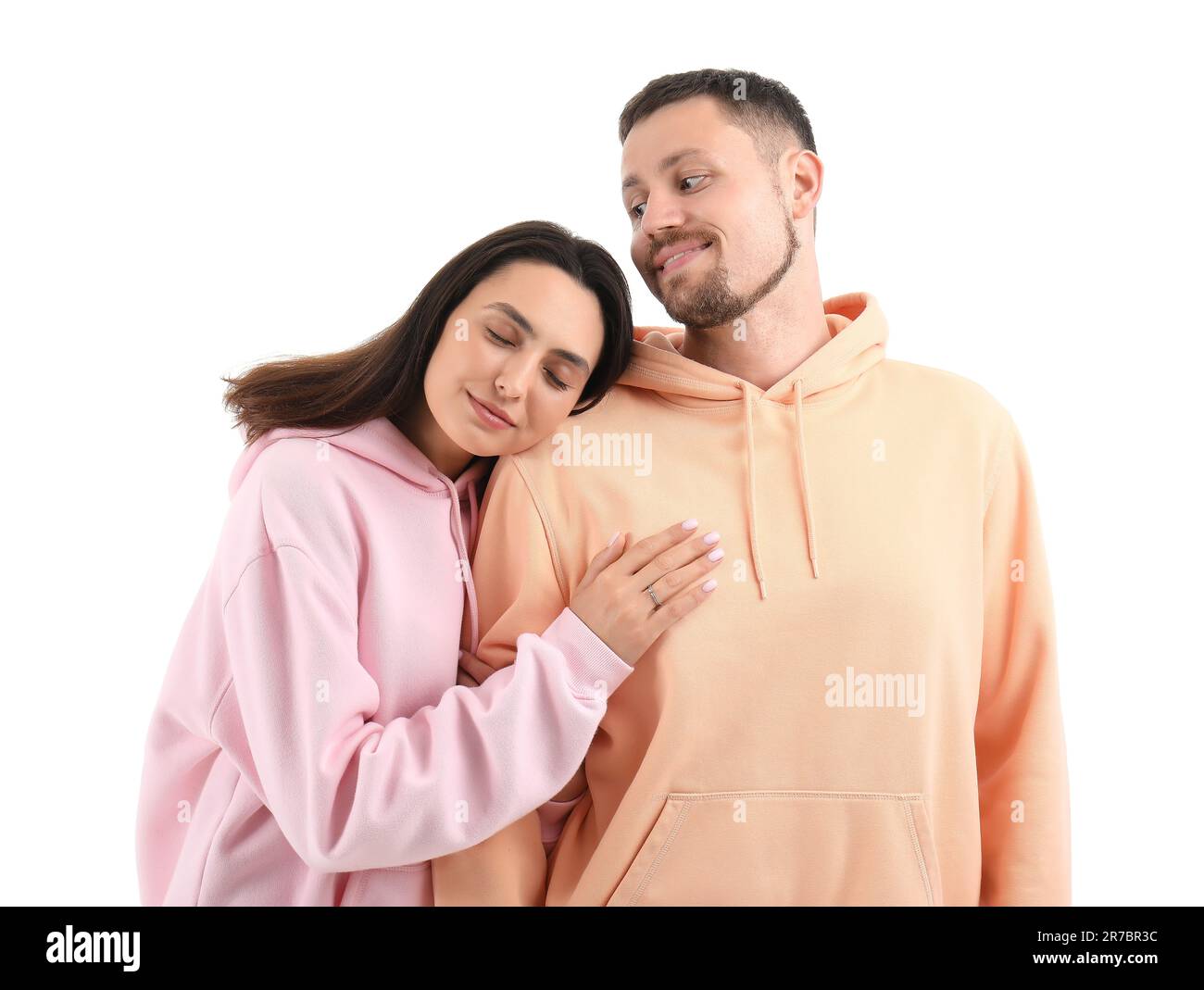 Happy engaged couple hugging on white background Stock Photo - Alamy