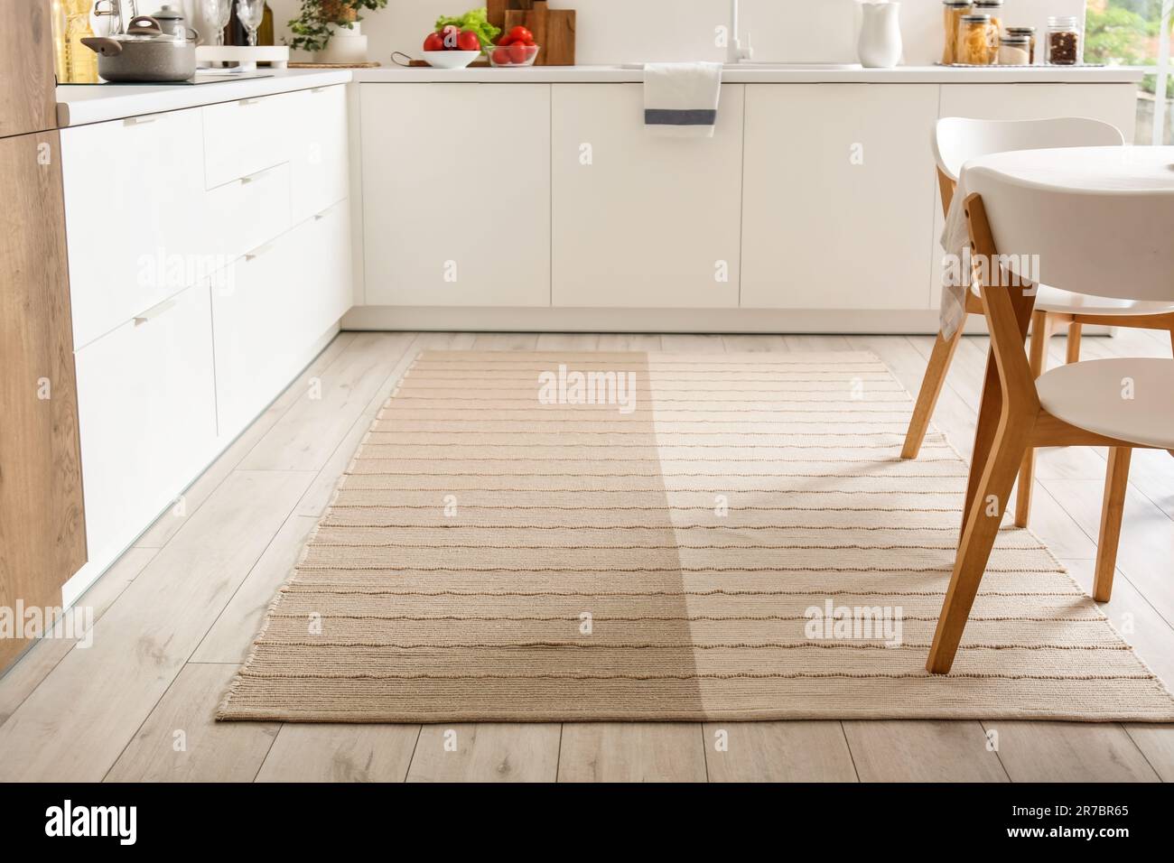 Stylish beige carpet in interior of modern kitchen Stock Photo - Alamy