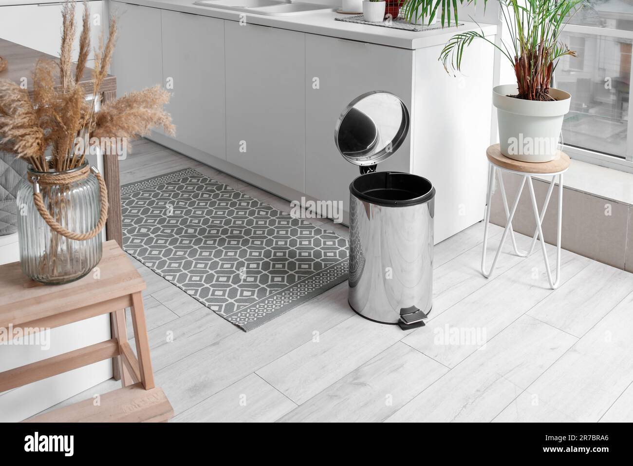 Opened metallic trash bin in interior of modern kitchen Stock Photo - Alamy
