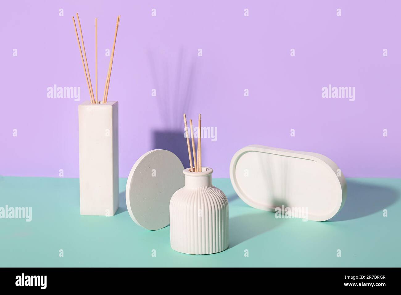 Bottles of reed diffuser on color background Stock Photo - Alamy