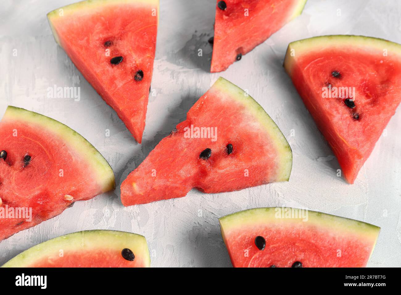 Pieces of fresh watermelon on grey background Stock Photo - Alamy