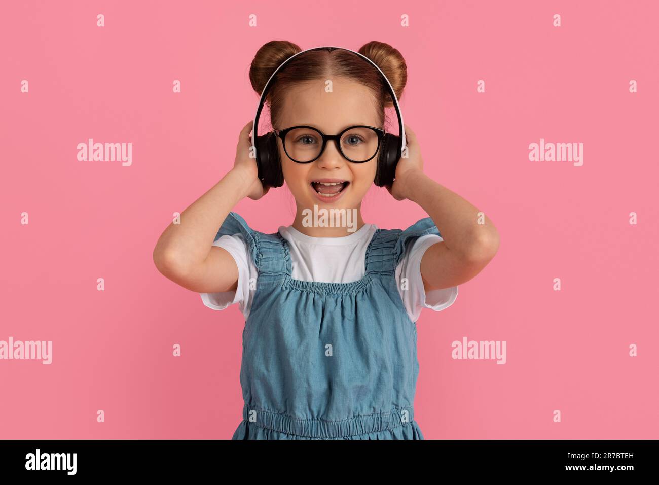 Portrait Of Cute Cheerful Little Girl Wearing Wireless Headphones Stock ...