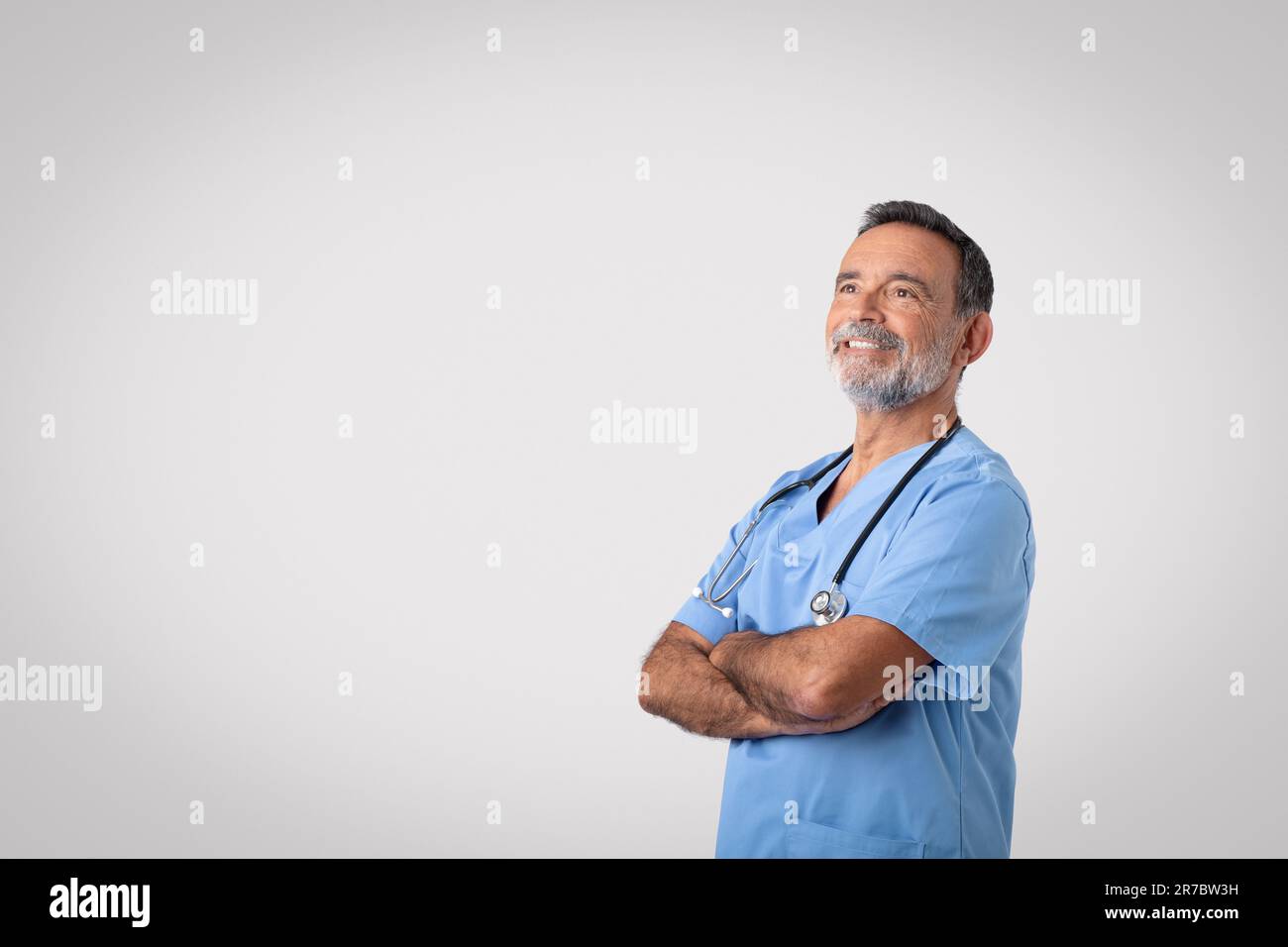 Medical ad and offer. Smiling caucasian old man doctor in uniform ...