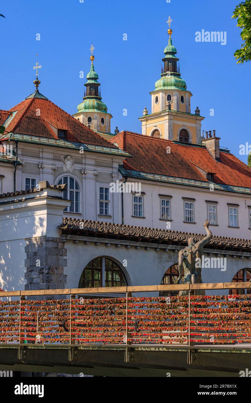 hundreds of red love padlocks hang on the sides of the butchers bridge ...