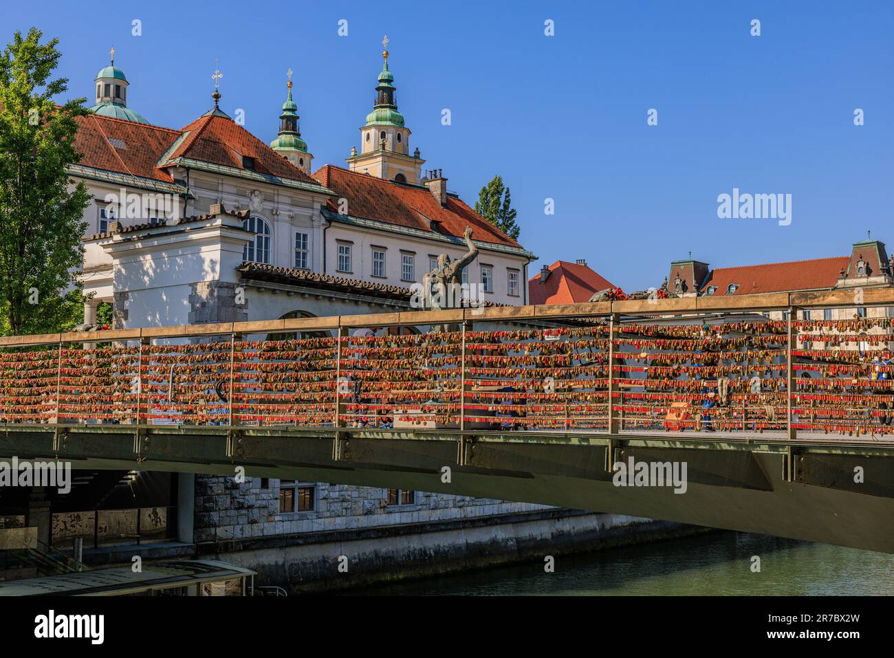 hundreds of red love padlocks hang on the sides of the butchers bridge ...