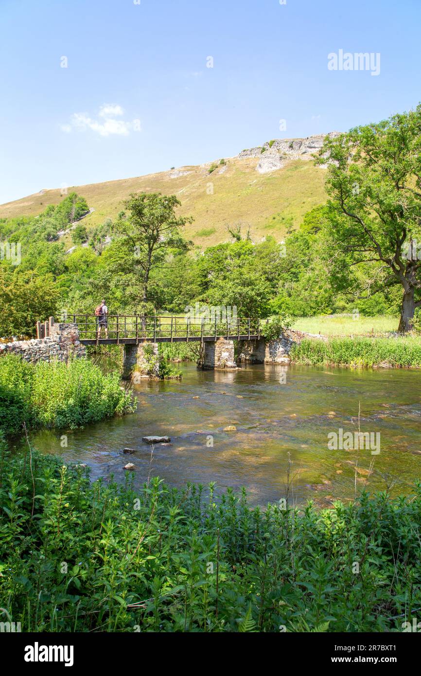 Footbridge over the river Wye in the Derbyshire Peak District beauty ...