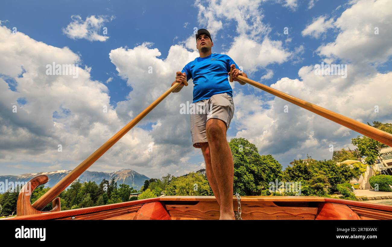 close up of pletnar standing upright on the stern of his pletna boat ...