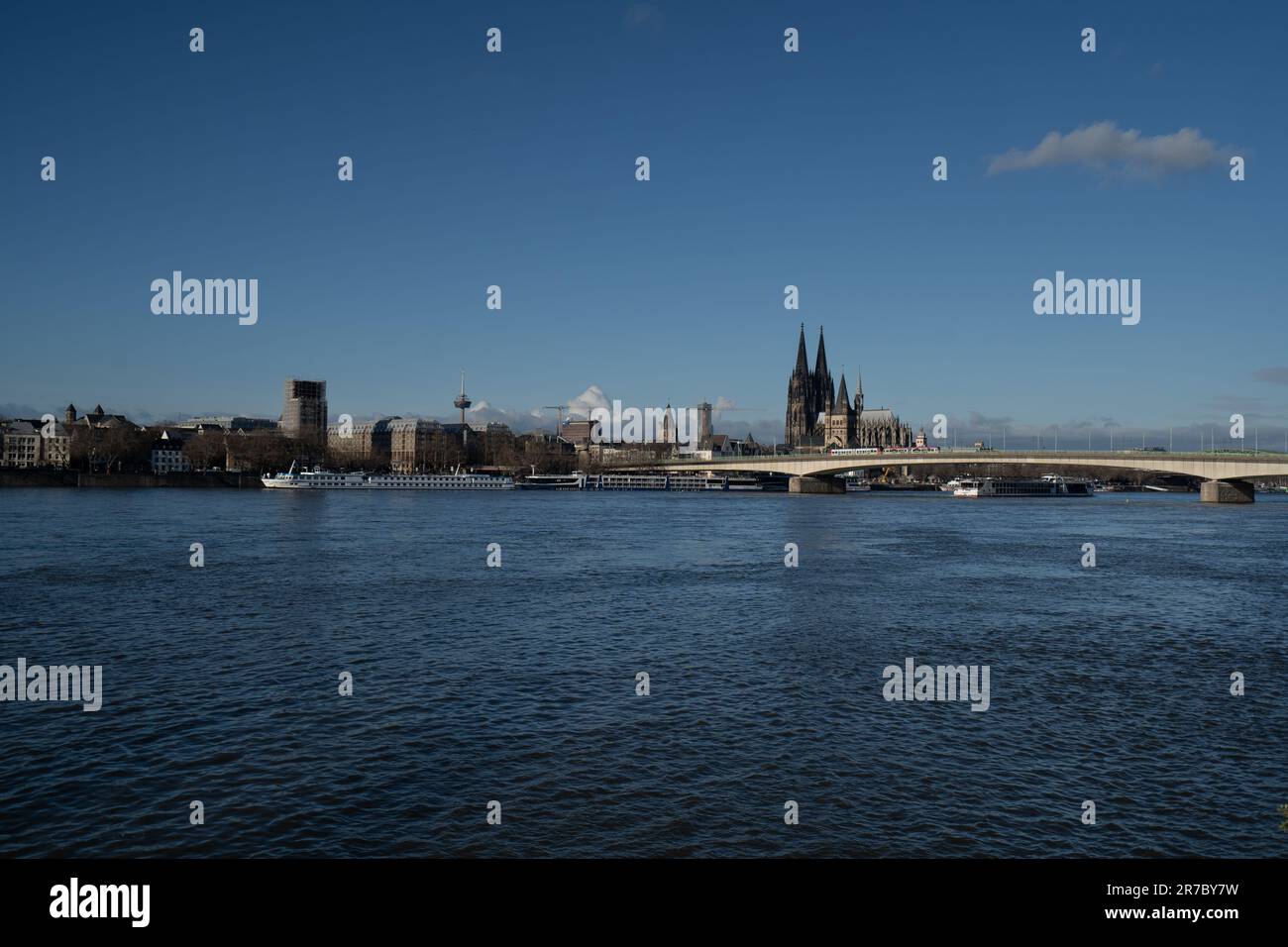 A magnificent stone bridge spanning the Rhine River in Cologne, Germany ...
