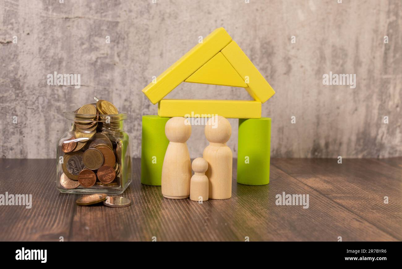 Back view of happy family is standing near their modern house and ...