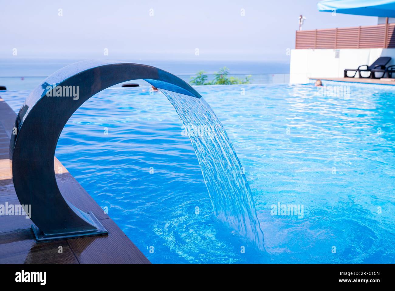 Empty Swimming pool with waterfall jet and jacuzzi in action Stock ...