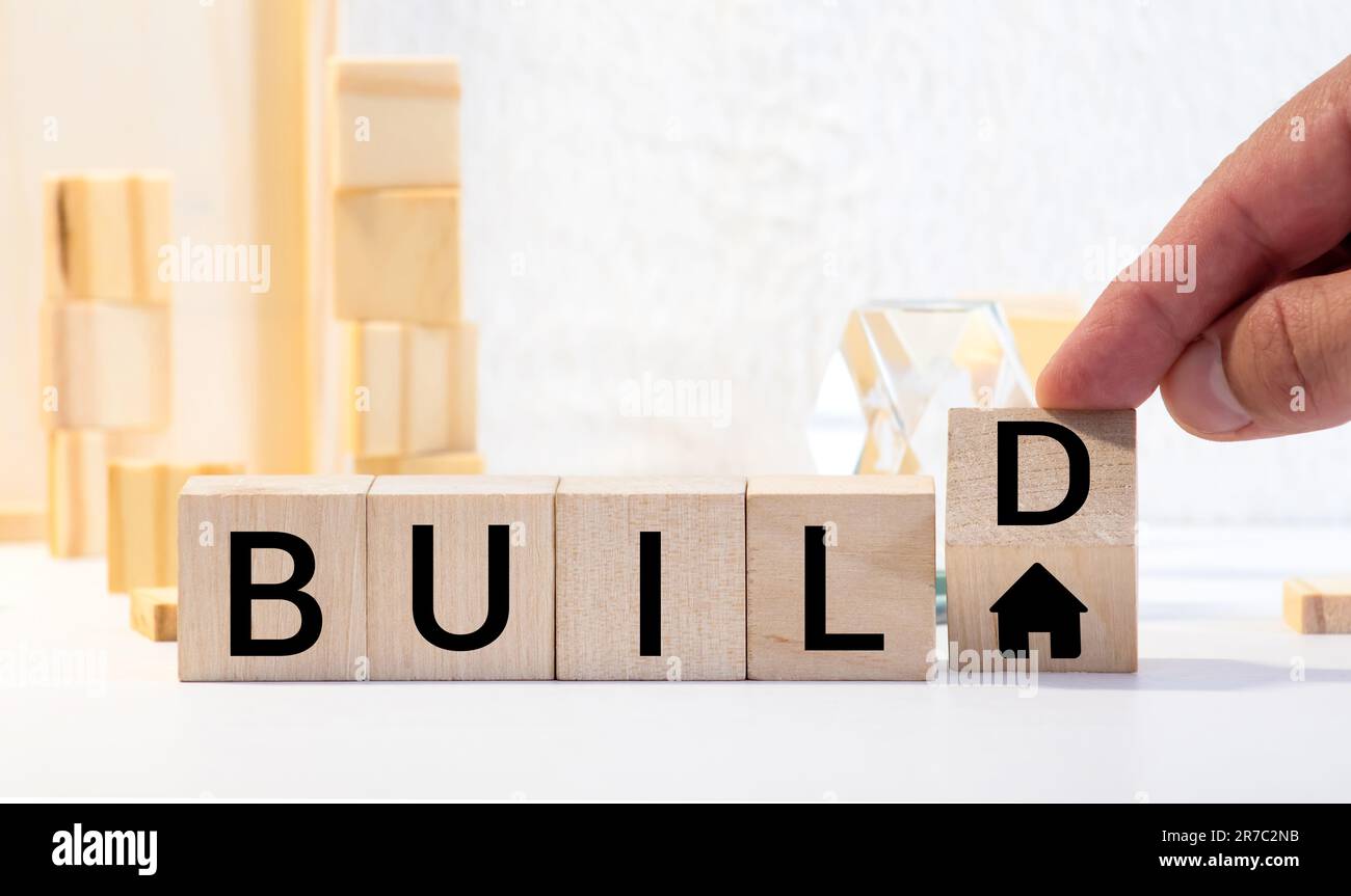 Time to rebuild symbol. Turned wooden cubes and changes the word 'build ...