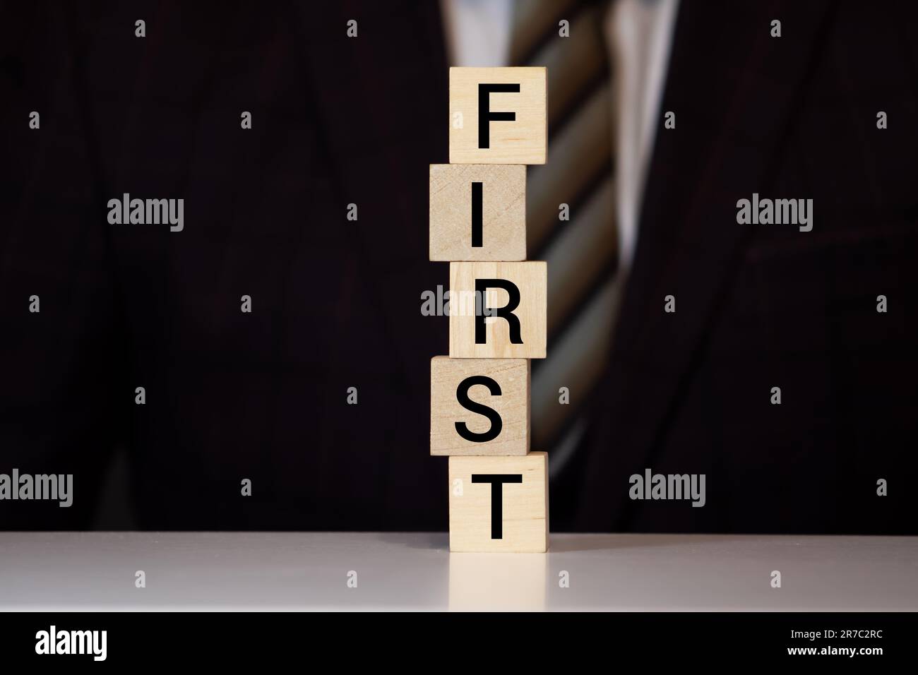 Words First Aid made of wooden cubes on light grey table, top view ...