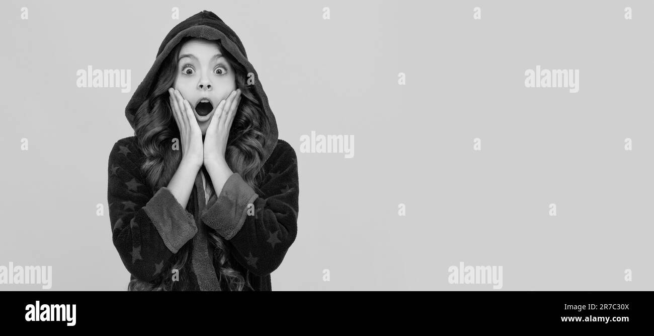 Shocked expression. Shocked child keeping dropped jaw with hands ...