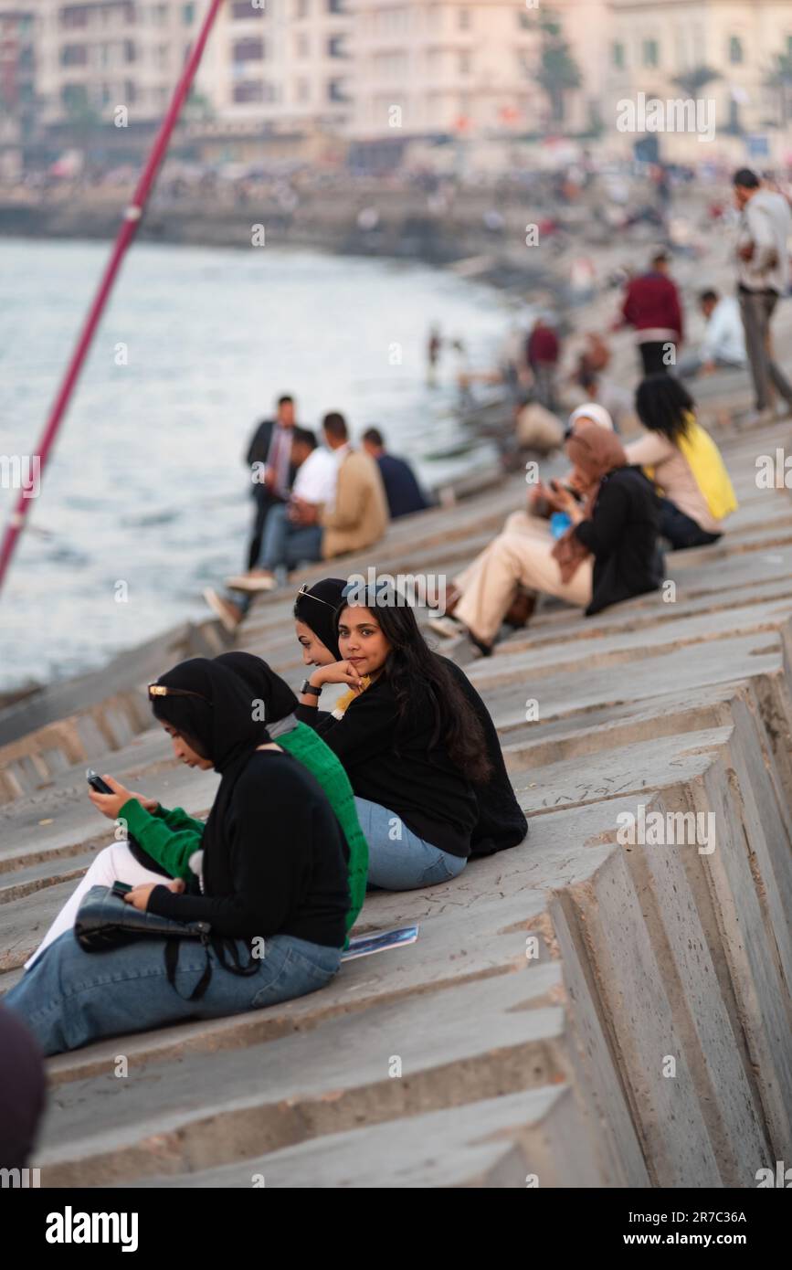 Alexandria, Egypt. December 1st 2022 Young Egyptian women sit on ...