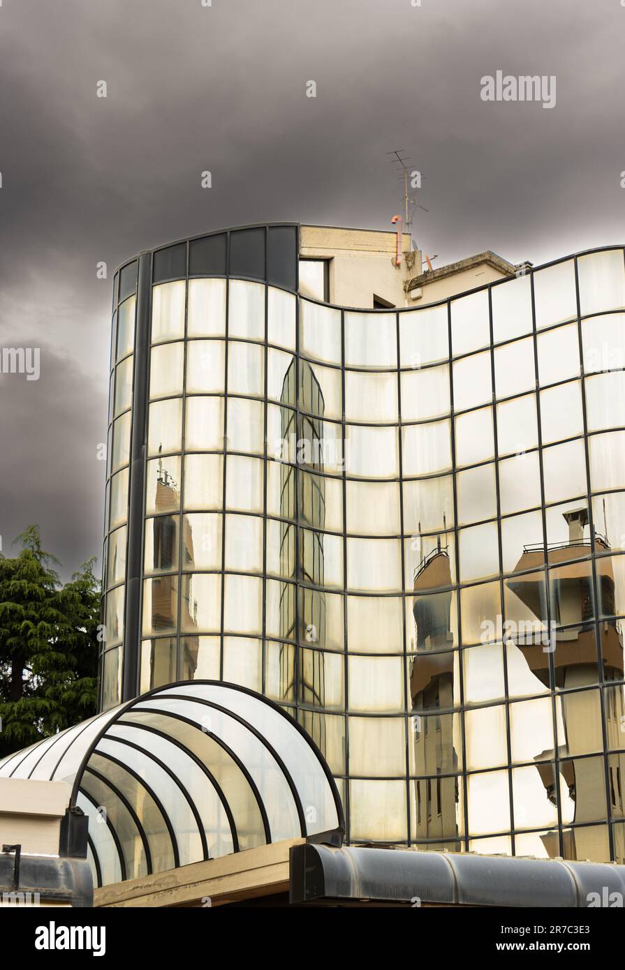 Detail of reflective glazed building in which the surrounding ...