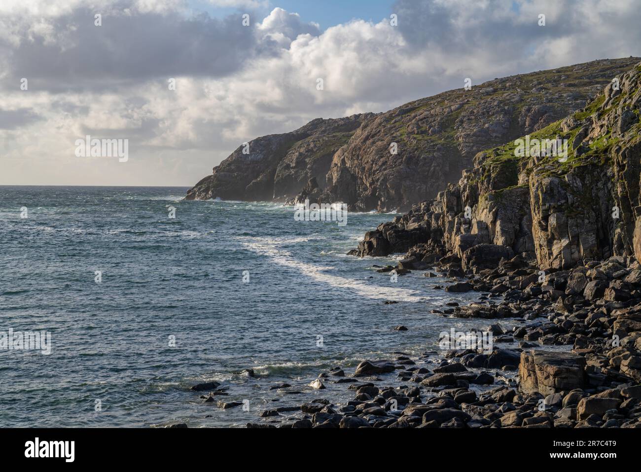 Looking out to sea along the cliffs on the edge of the bay at ...