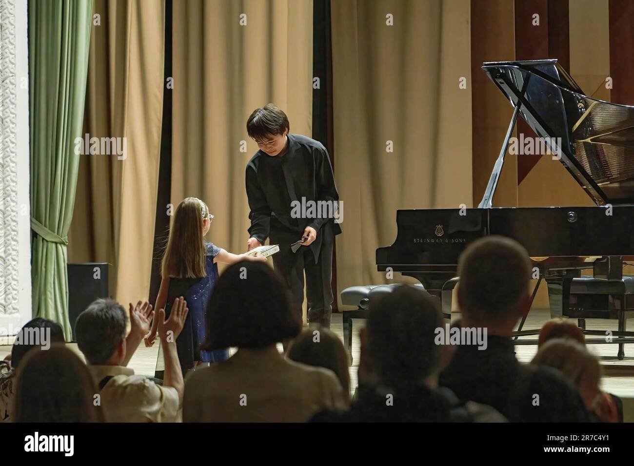 Virtuoso pianist Rui Ming receives a gift at the Platonov Arts Festival 2023 in Voronezh. Xuhua ...