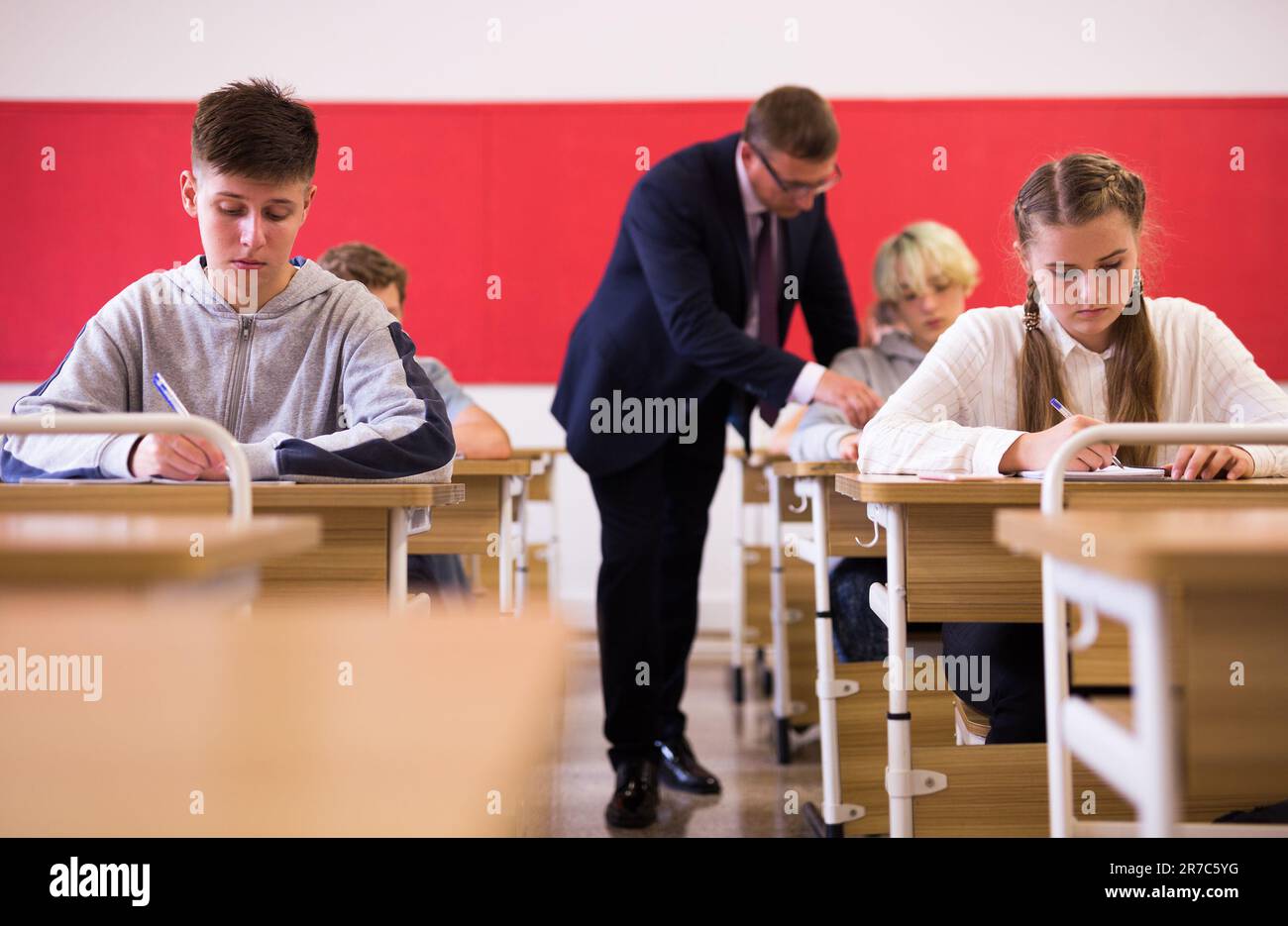 Teenage high school students diligently working in class Stock Photo ...