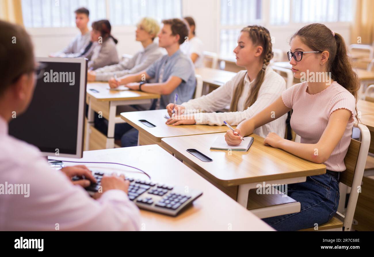 Teenage high school students diligently working in class Stock Photo ...