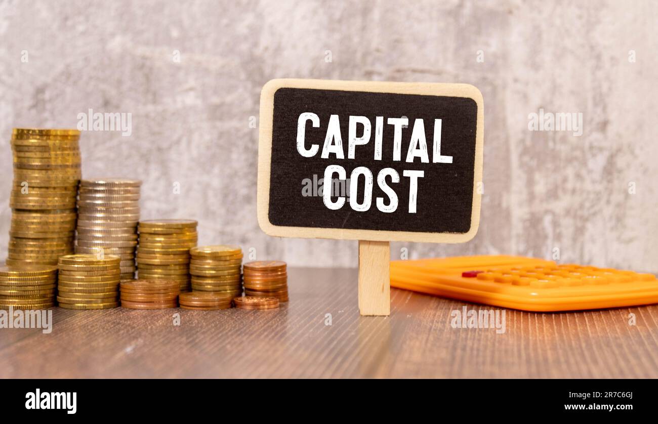 text CAPITAL COST on keyboard on white background Stock Photo - Alamy