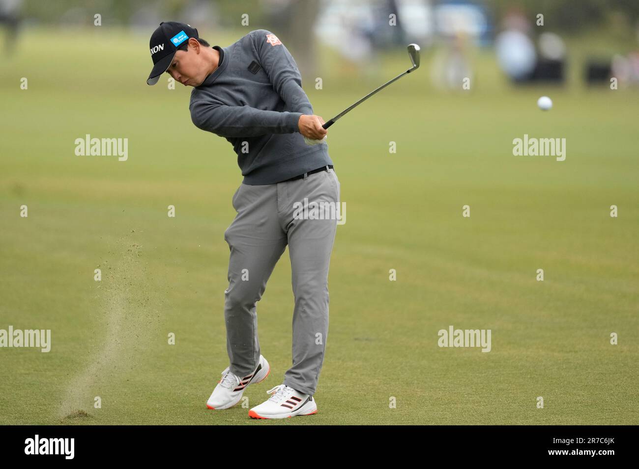 Yuto Katsuragawa hits from the fairway on the 17th hole during a ...