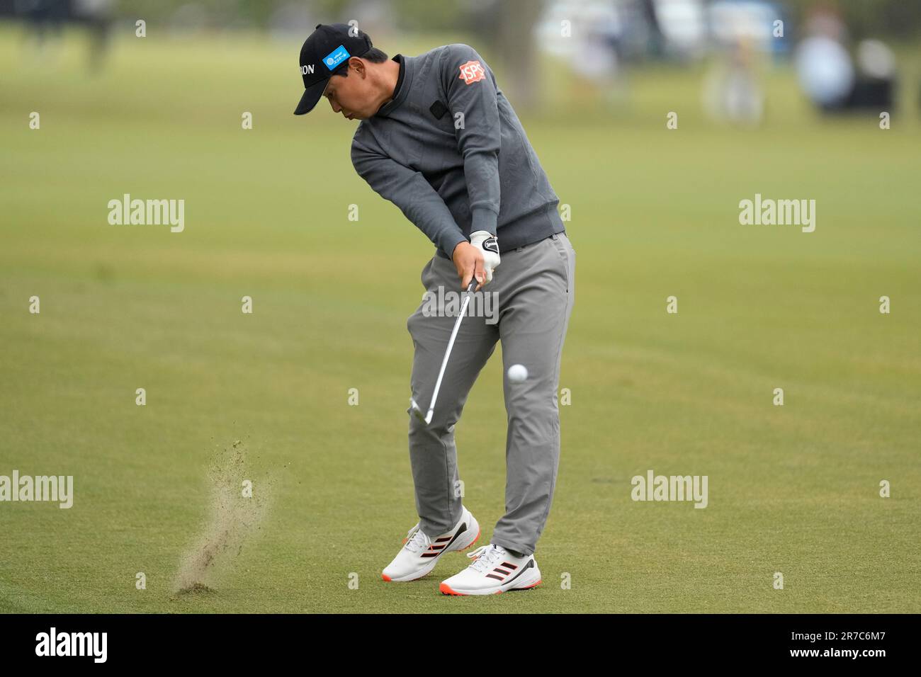 Yuto Katsuragawa hits from the fairway on the 17th hole during a practice round for the U.S ...