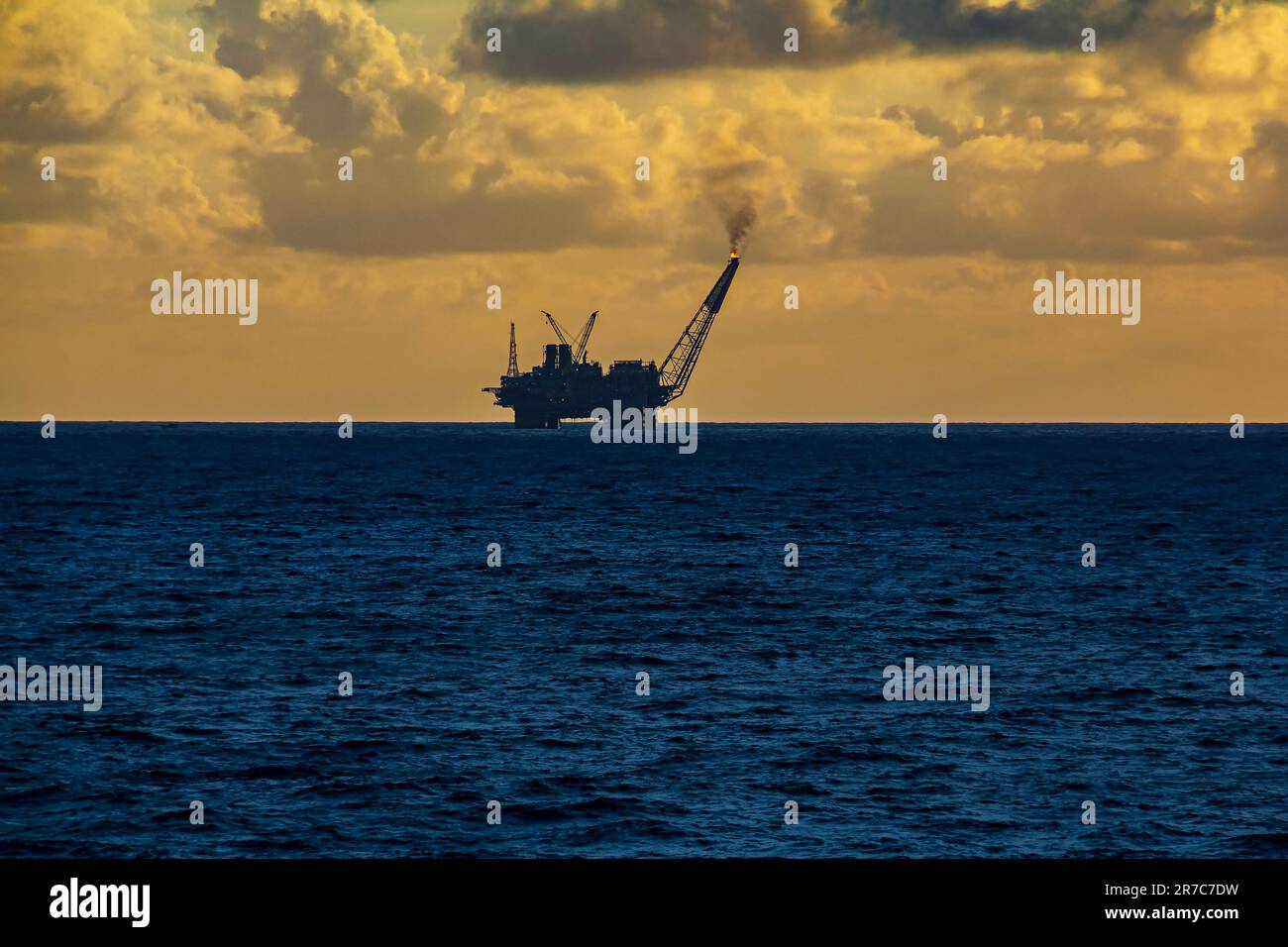 Offshore oil and rig platform in the sunset or sunrise time Stock Photo ...