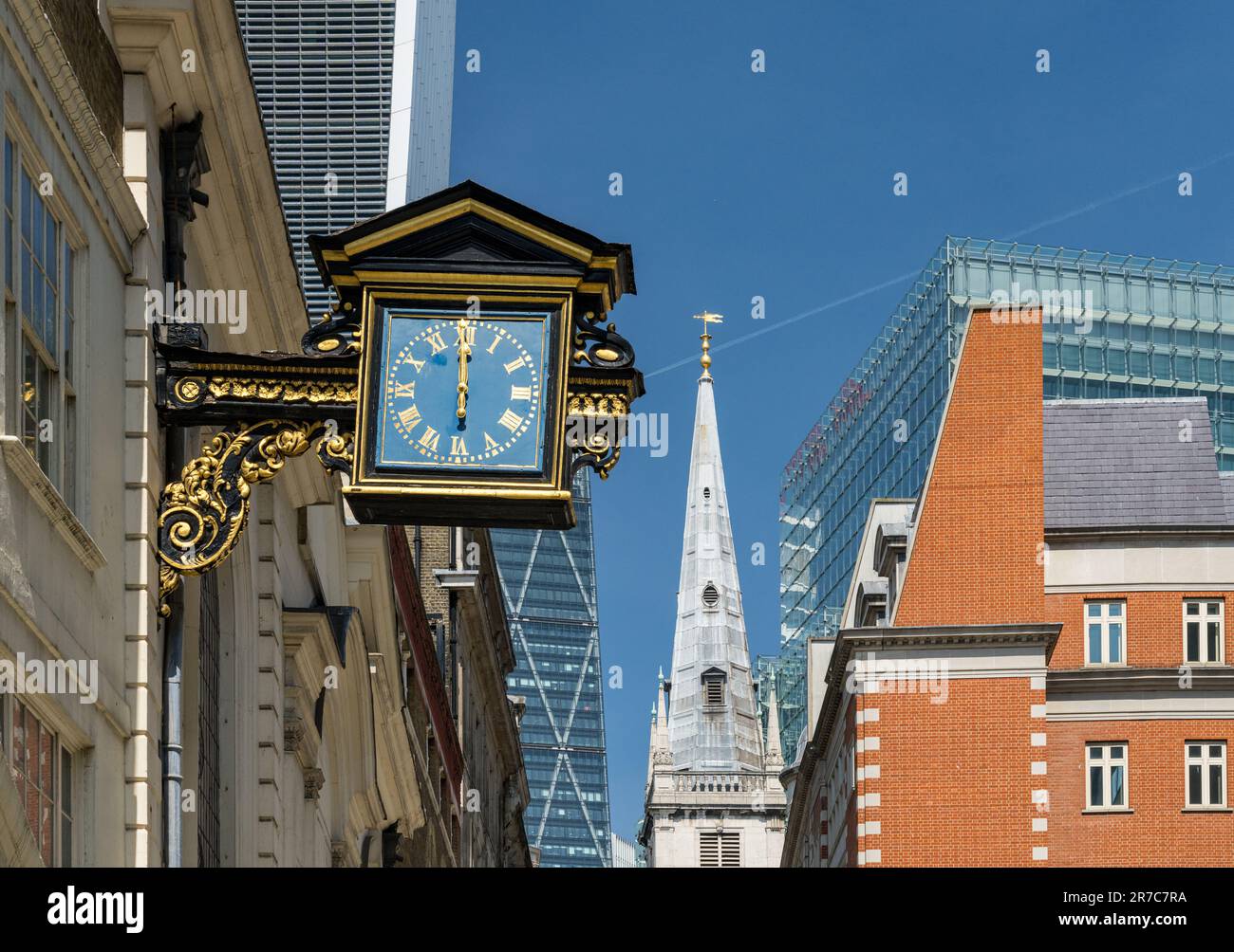 Old traditional city buildings with antique clock on St Mary at Hill ...