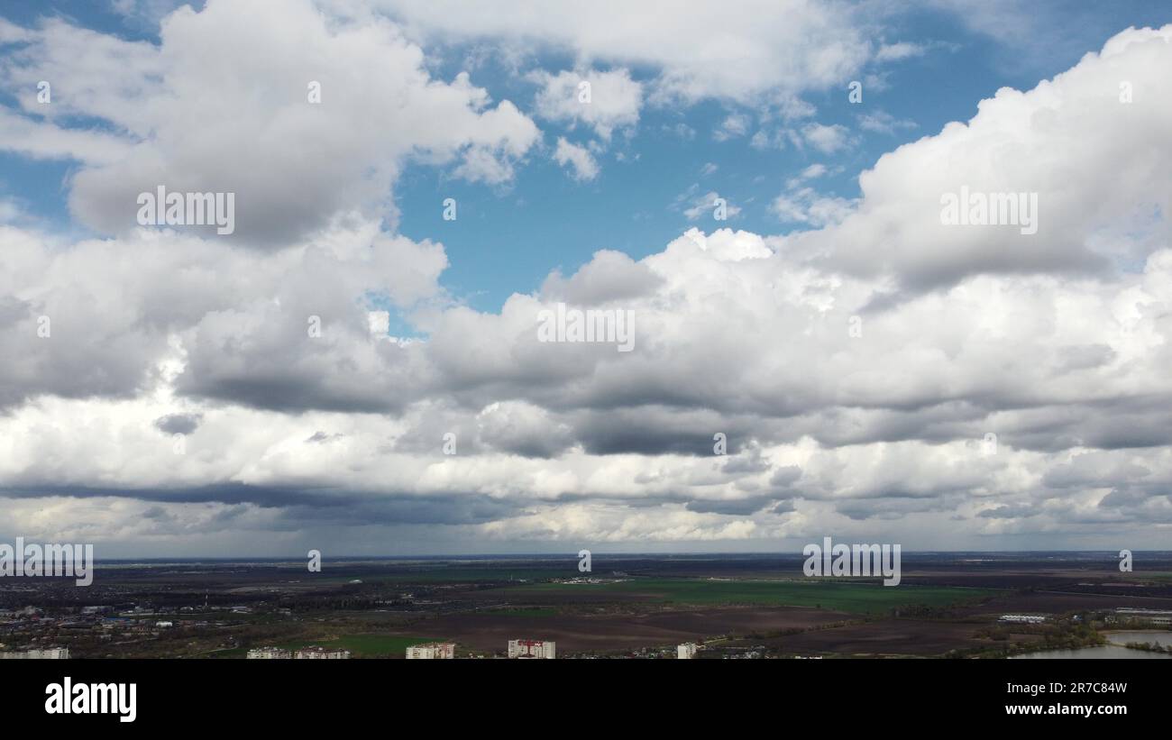 Fast movement of white cumulus clouds in blue sky during strong wind ...