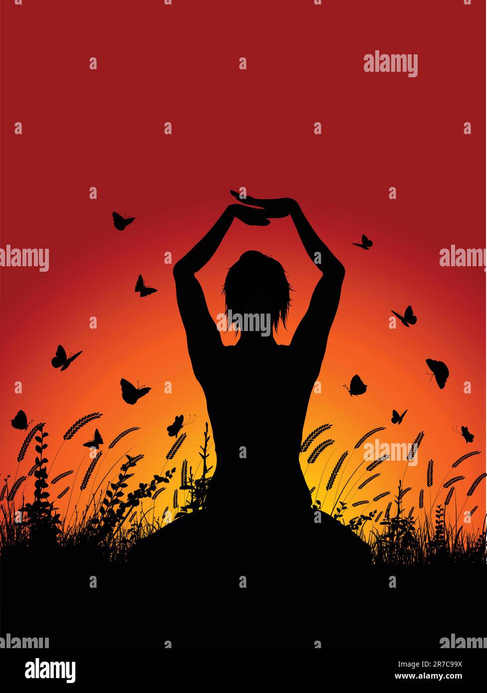 Silhouette of a female in a yoga pose against a sunset sky with ...