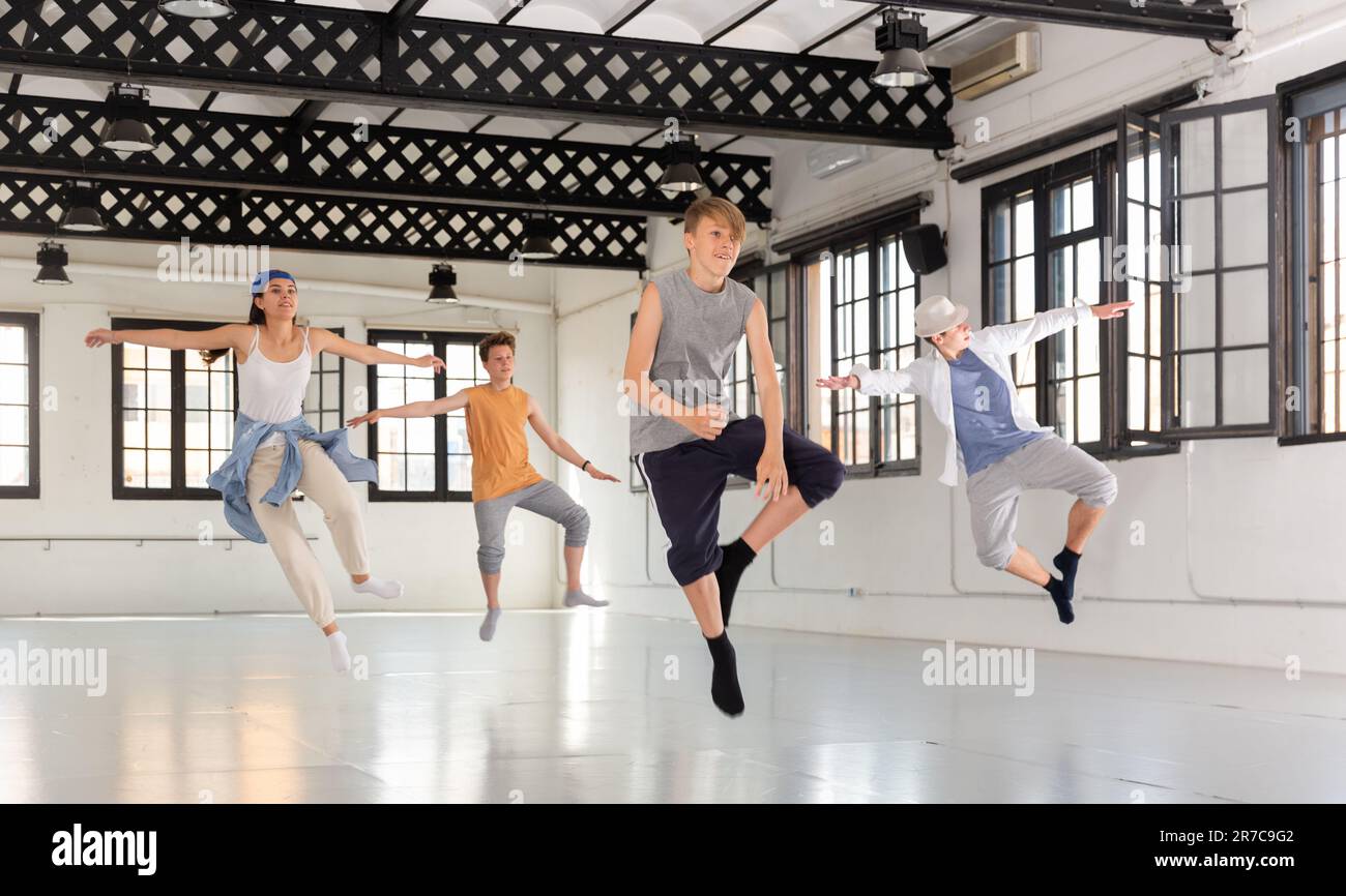 Teenage dancers jumping together during workout Stock Photo - Alamy
