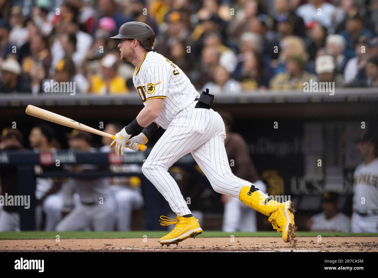 San Diego Padres' Jake Cronenworth runs to first after hitting the ball ...