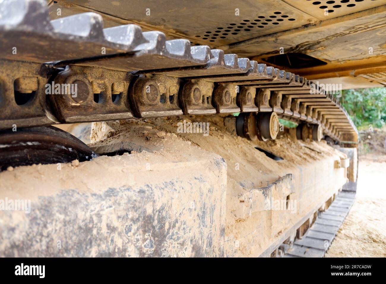 Underside of the iron tracks of an excavator Stock Photo - Alamy